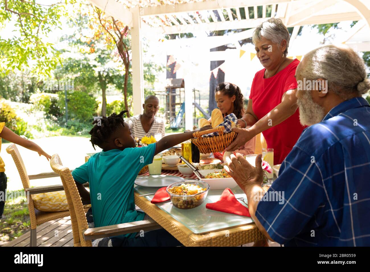 Multi generation family eating lunch table hi-res stock photography and ...