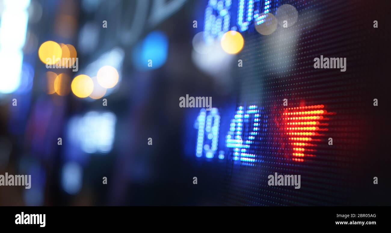 Stock market display screen in the city at night Stock Photo - Alamy