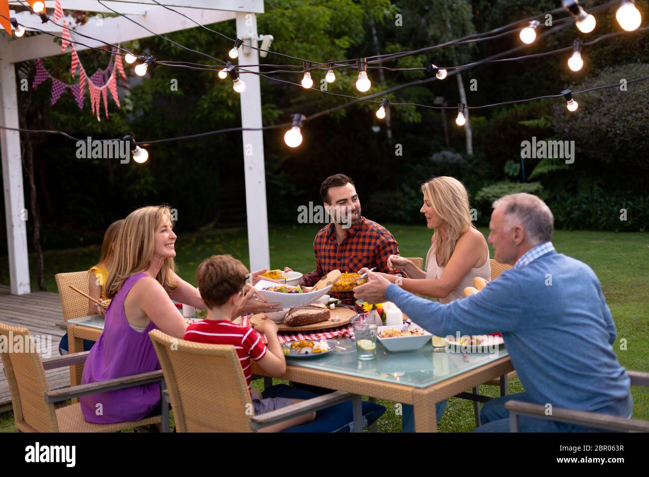 Woman eating family caucasian table hi-res stock photography and images ...