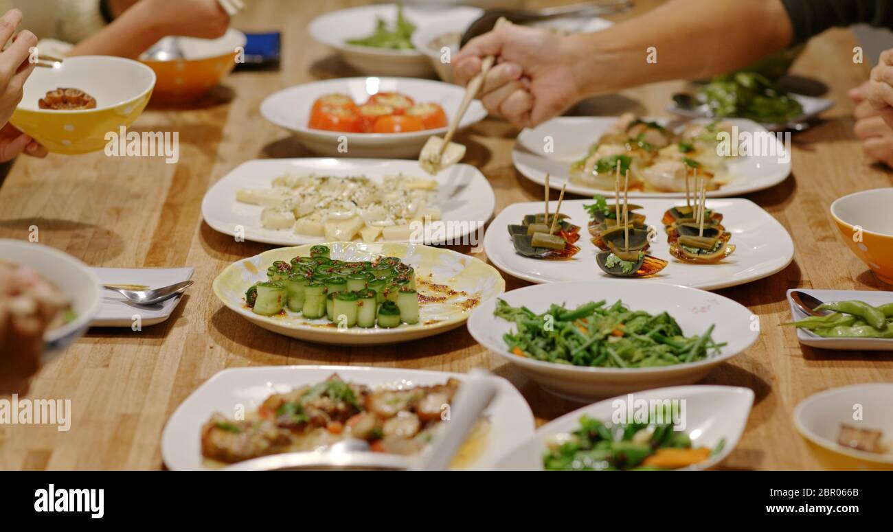 Chinese Family having dinner together at home Stock Photo - Alamy