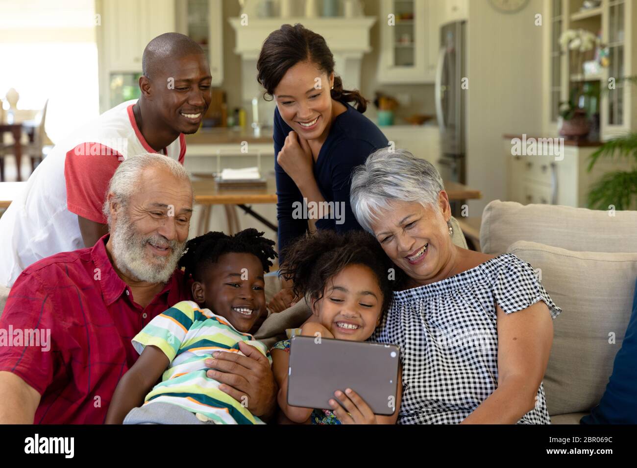 Multi-generation mixed race family at home Stock Photo - Alamy