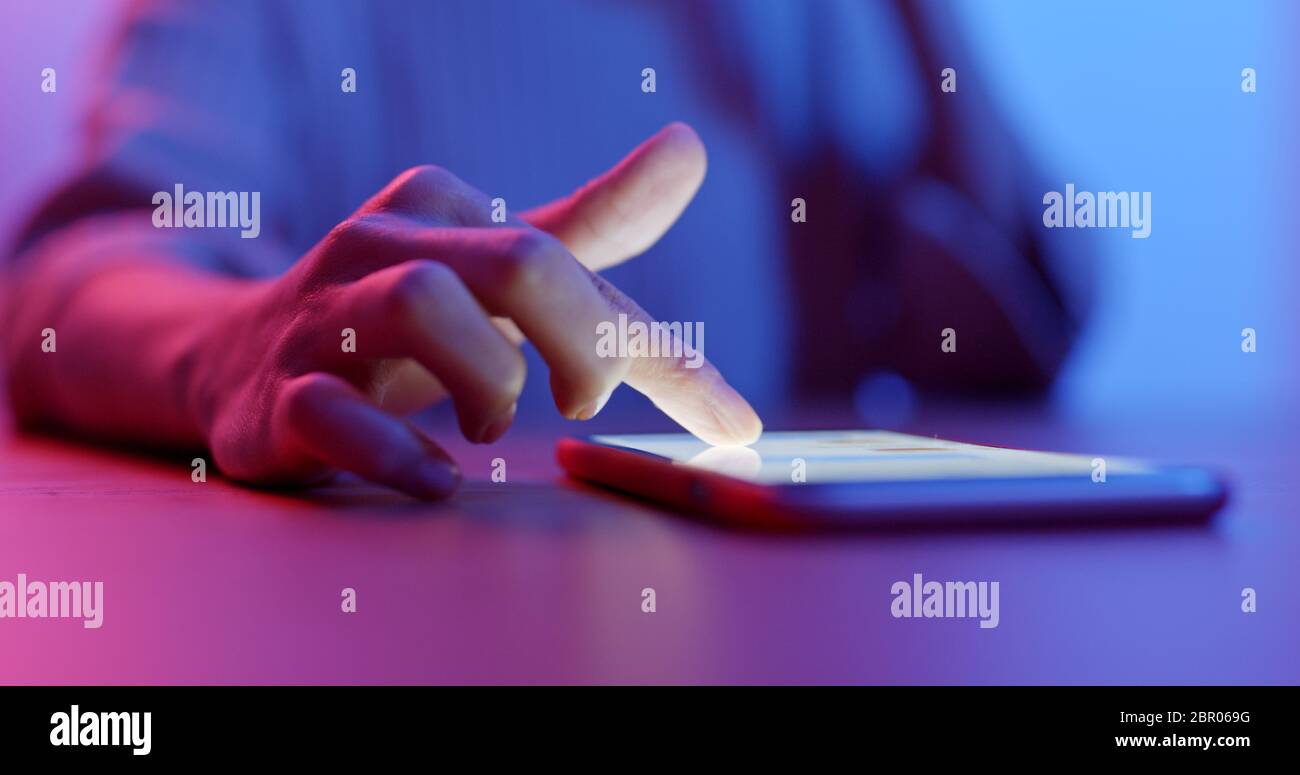 Use of cellphone at night Stock Photo - Alamy