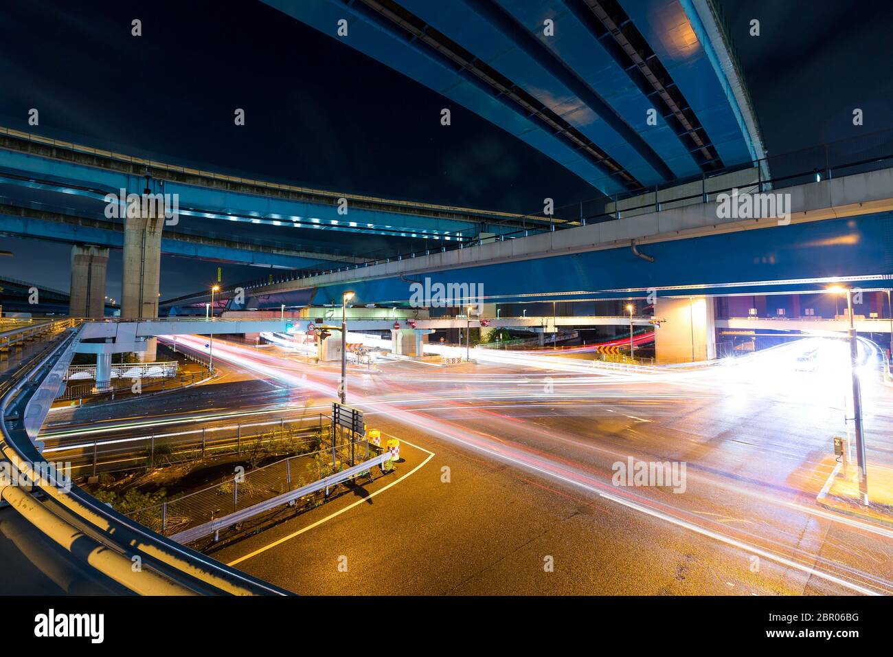 Traffic rail under highway at night Stock Photo - Alamy