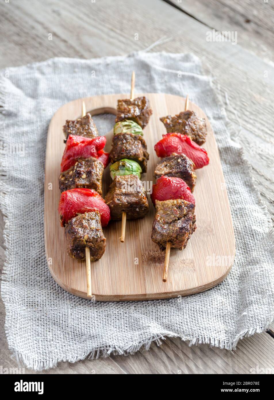Grilled beef skewers with pepper and brussels Stock Photo - Alamy