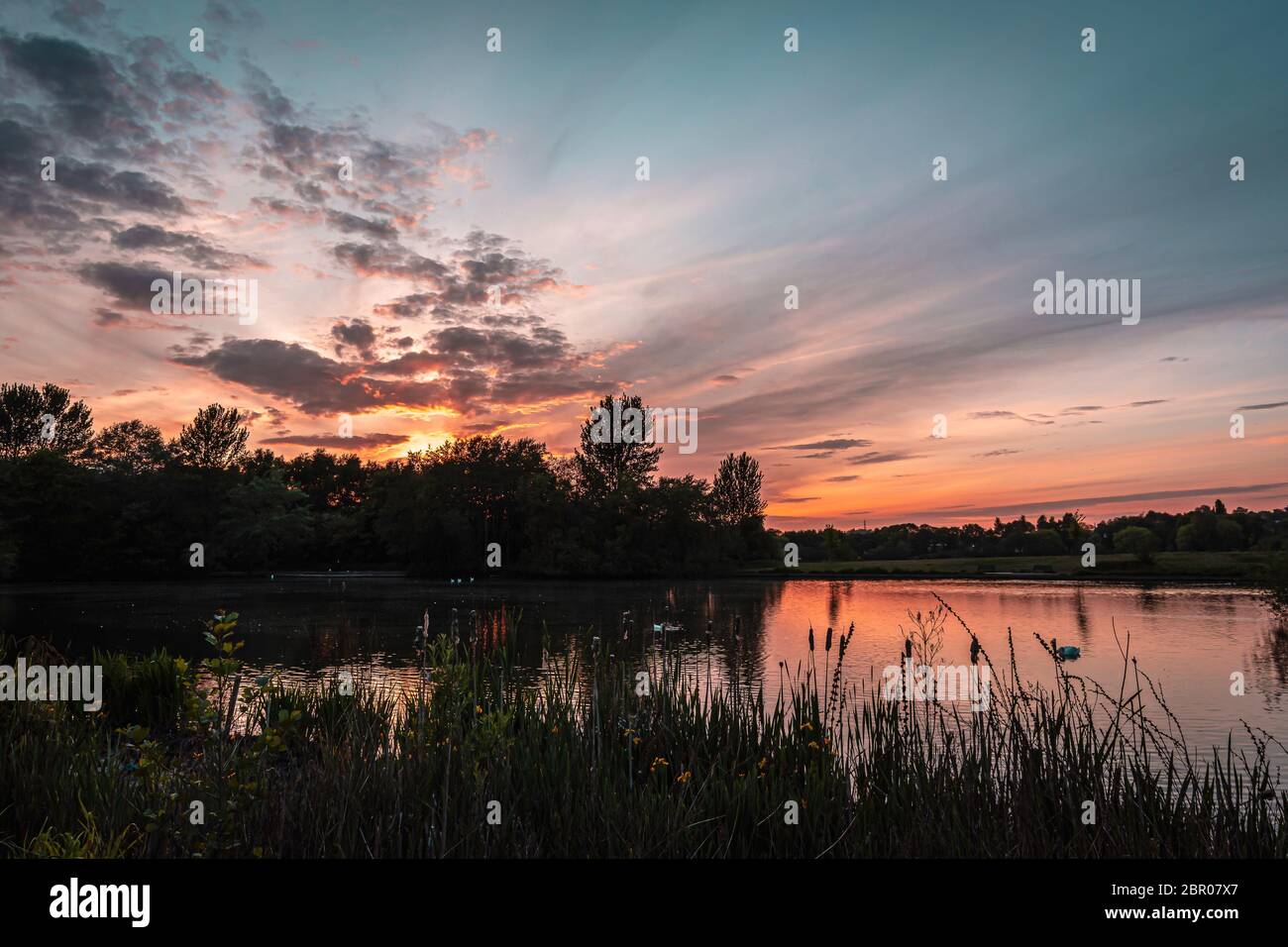 Sunset over Westport lake in Stoke on Trent, Staffordshire, UK.Tranquil ...