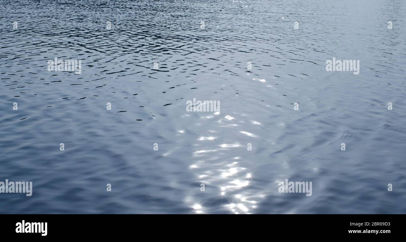 Water ripple with sunlight flare Stock Photo - Alamy
