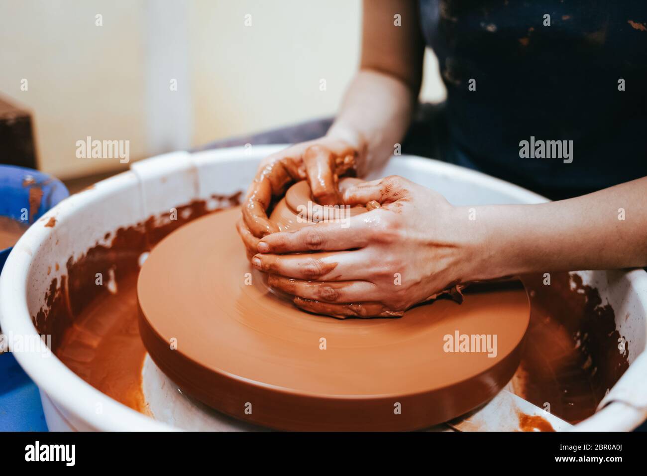 Professional potter works on a pottery wheel Stock Photo - Alamy