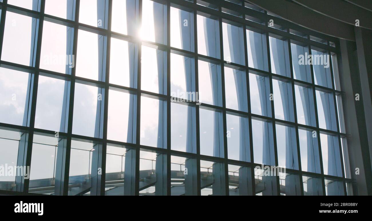 Airport window with sunlight flare Stock Photo - Alamy