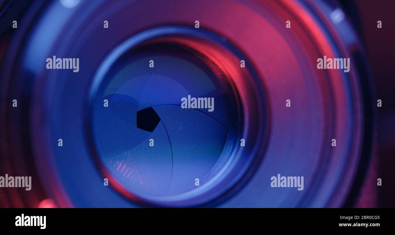 Changing Camera lens aperture with pink and purple Stock Photo - Alamy