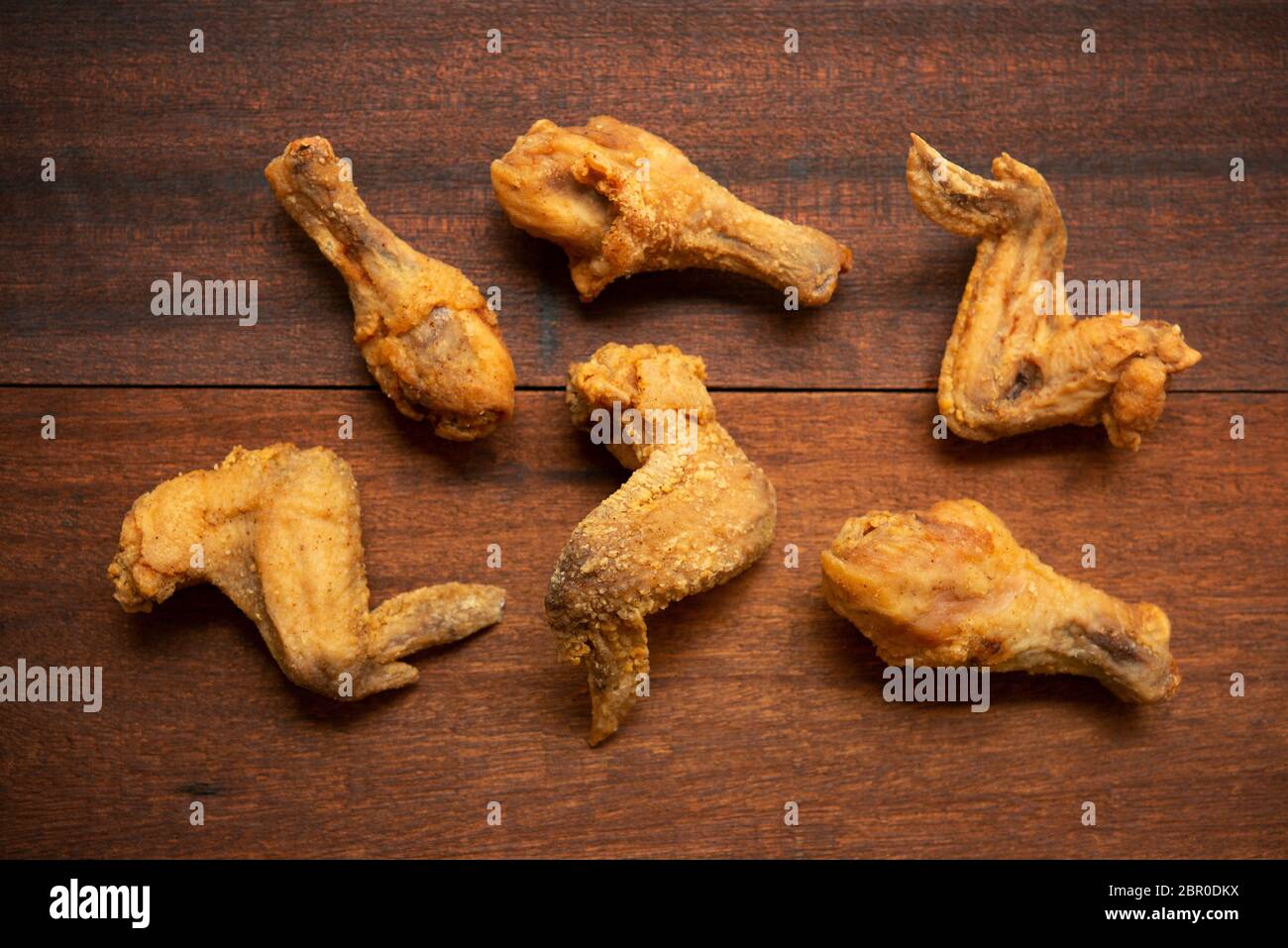 Top view flat lay original recipe fried chickens, on dark wooden ...
