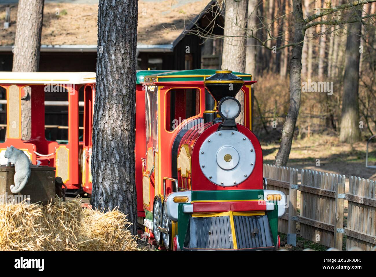 Railway for children. A red steam locomotive for small children drives ...