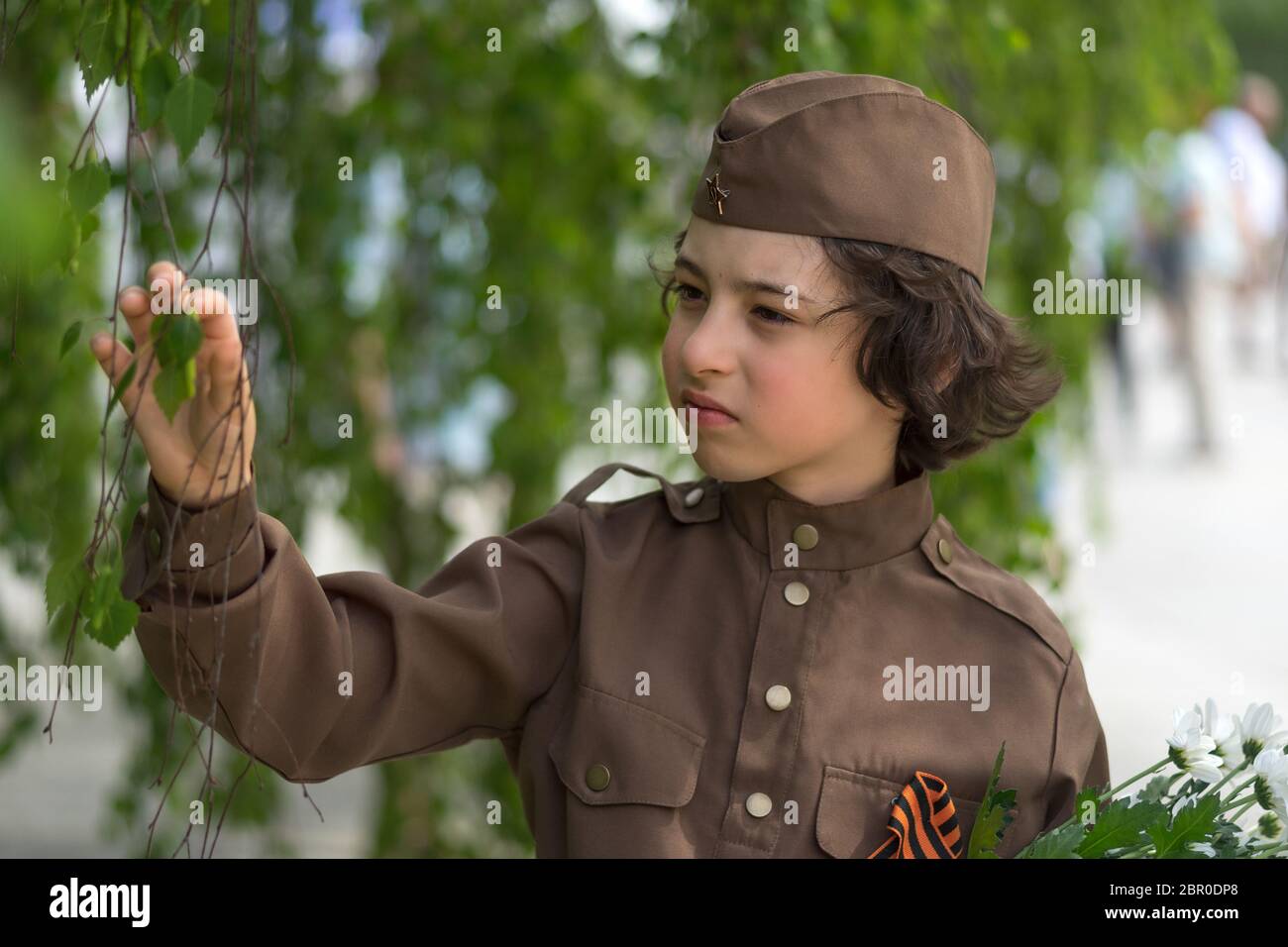 Portrait of a boy in the uniform of a soldier of the Red Army during ...