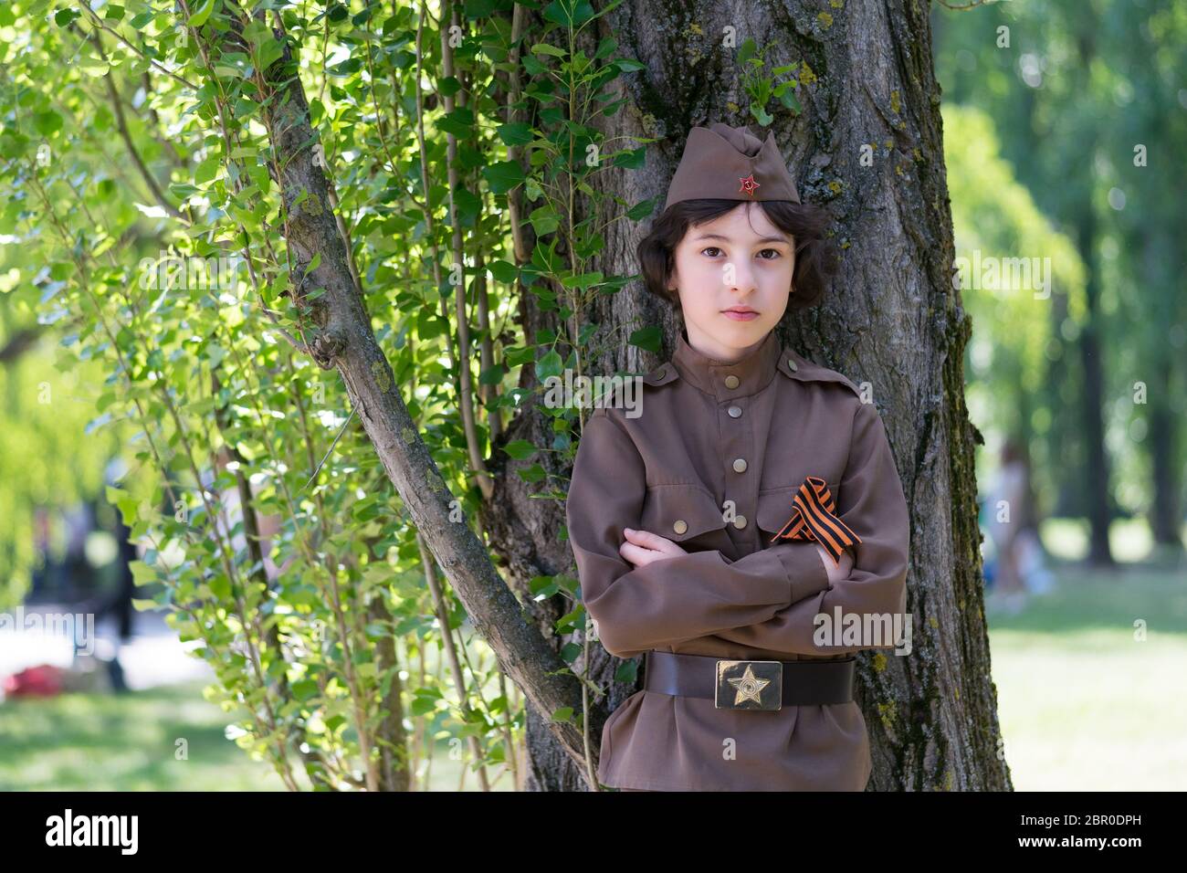 Portrait of a boy in the uniform of a soldier of the Red Army during ...