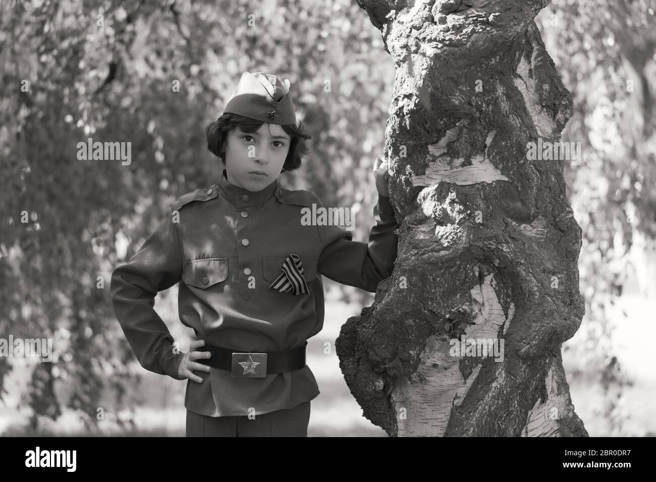 Portrait of a boy in the uniform of a soldier of the Red Army during ...