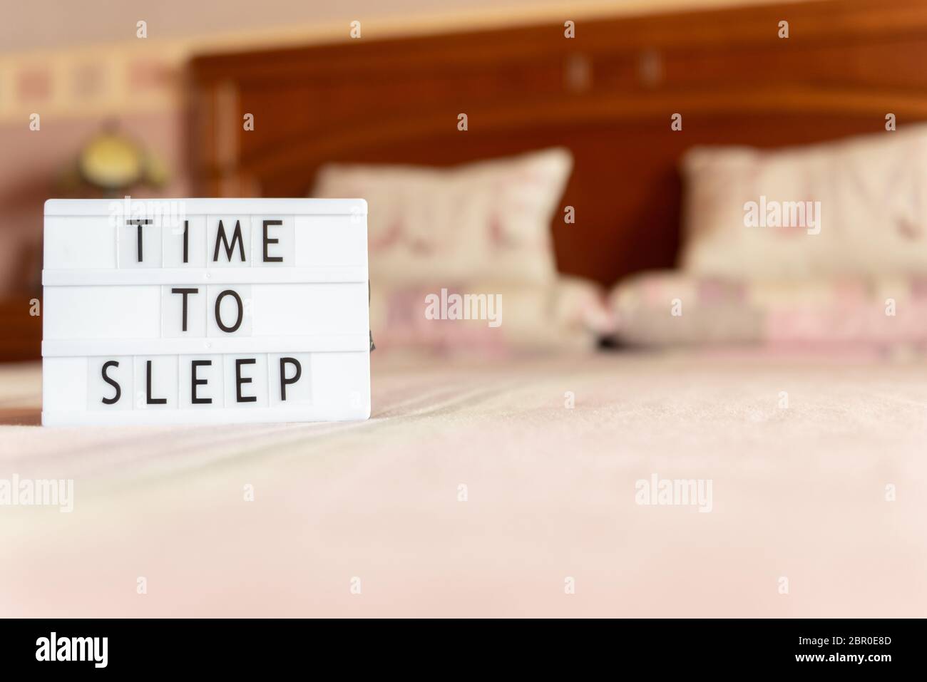 Lightbox with text: time to sleep on bed, copy space Stock Photo - Alamy
