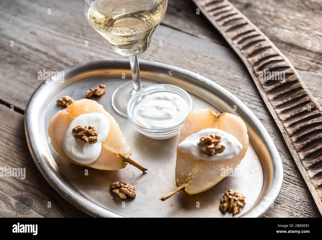 Halves of poached pear Stock Photo - Alamy
