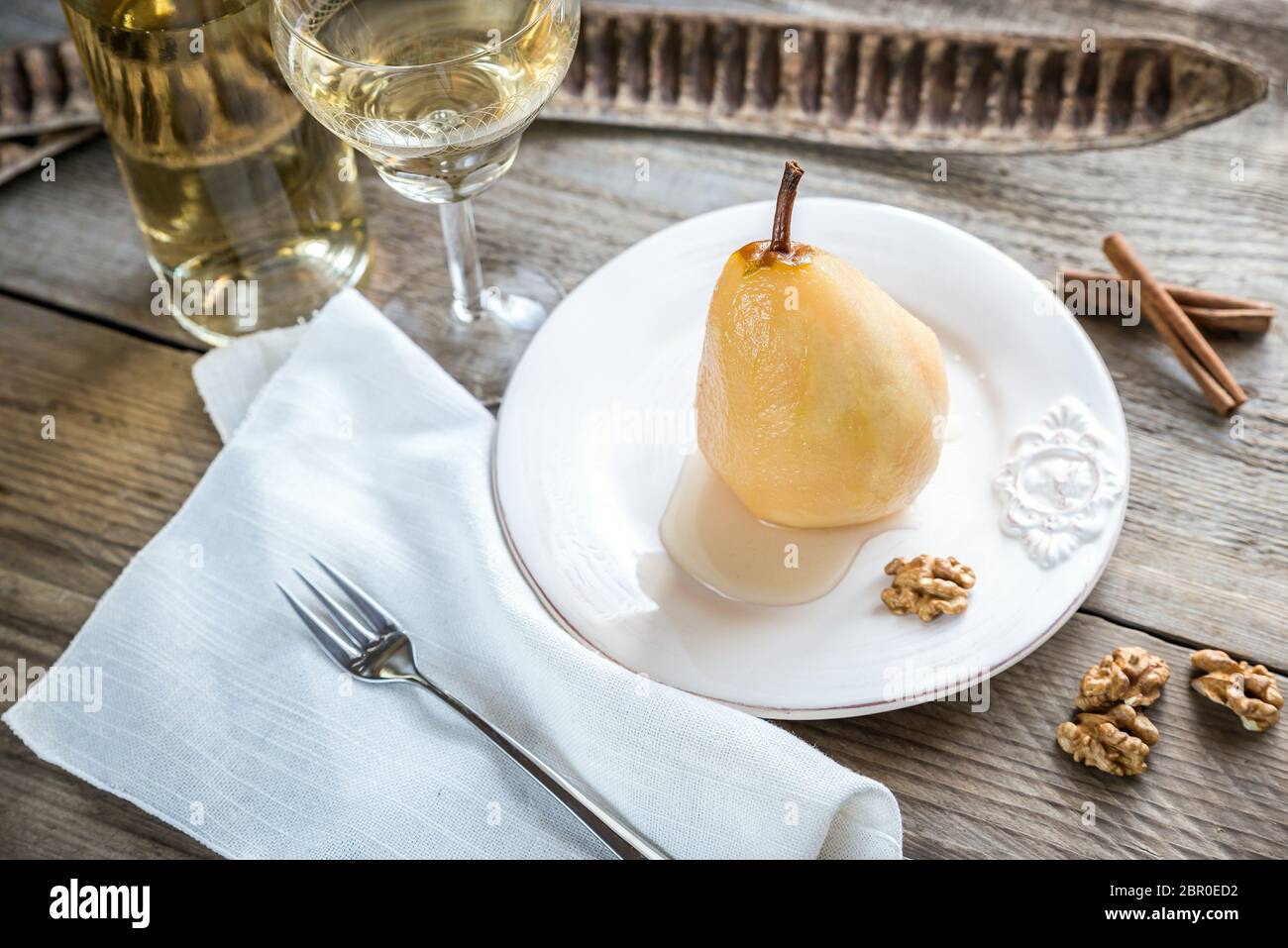 Pear poached in white hi-res stock photography and images - Alamy