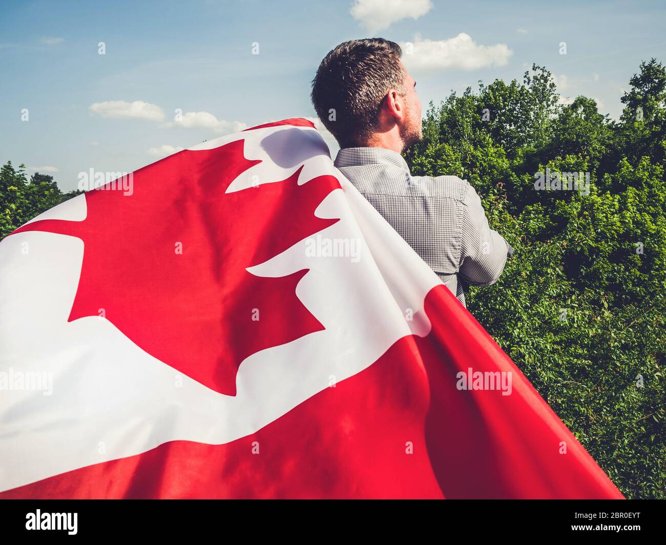 Young man waving canadian flag hi-res stock photography and images - Alamy
