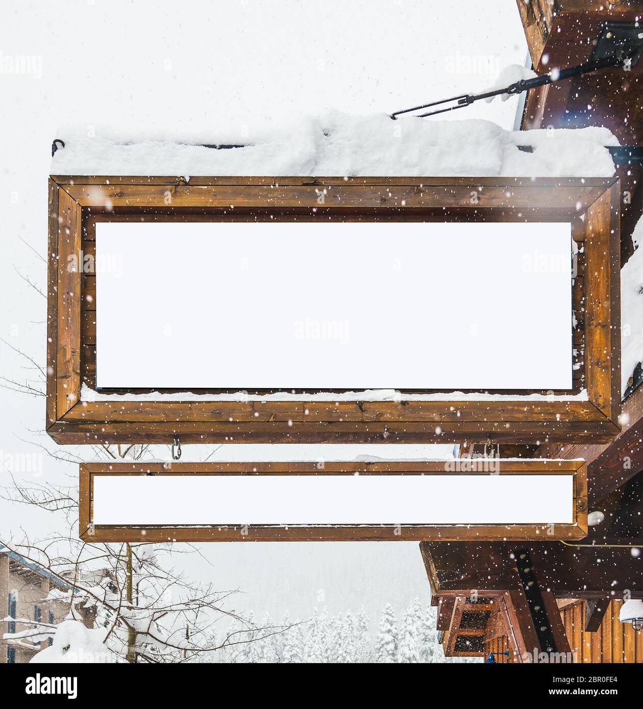 wooden billboard with snow covered with the snow for product display ...