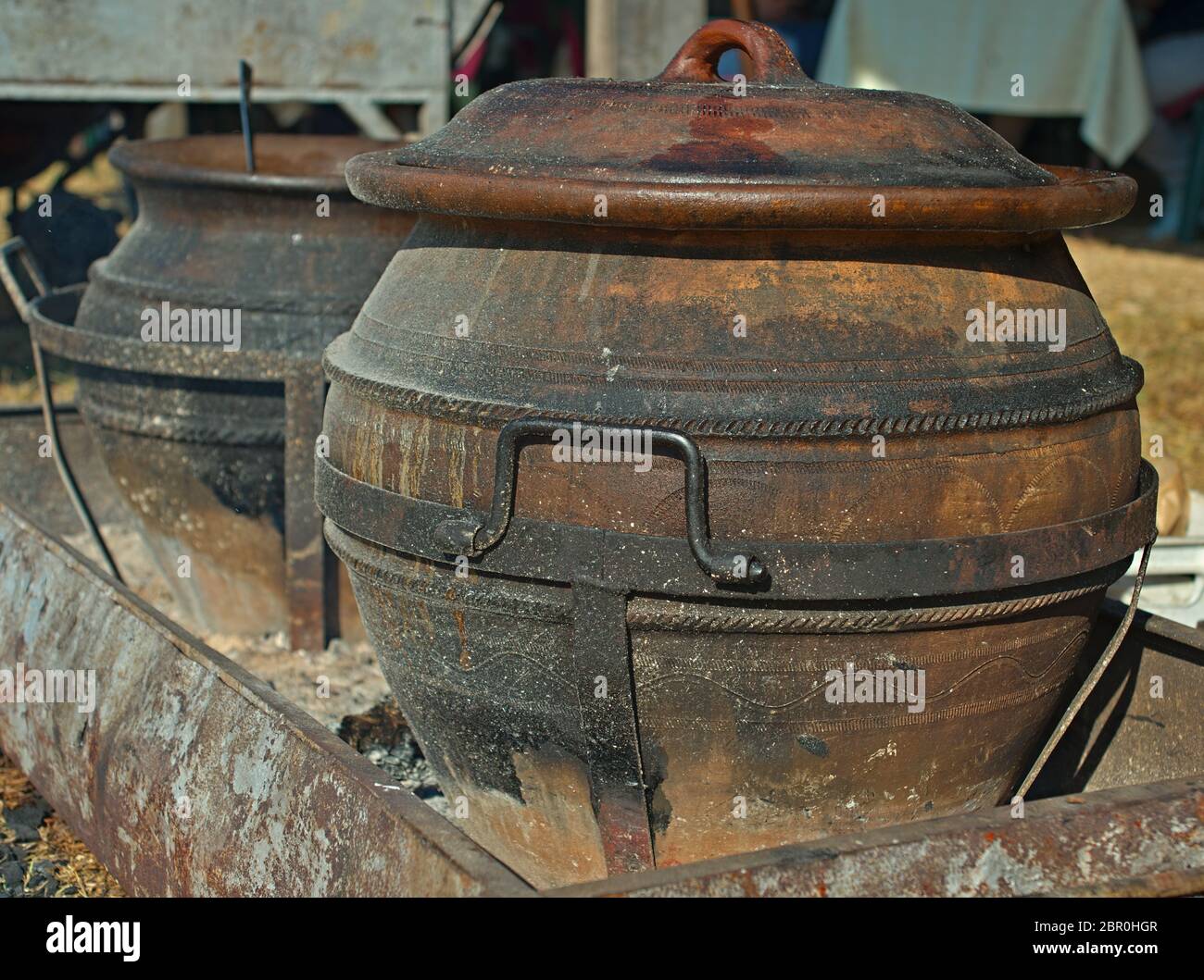 Two old traditional pots for cooking outdoor Stock Photo - Alamy