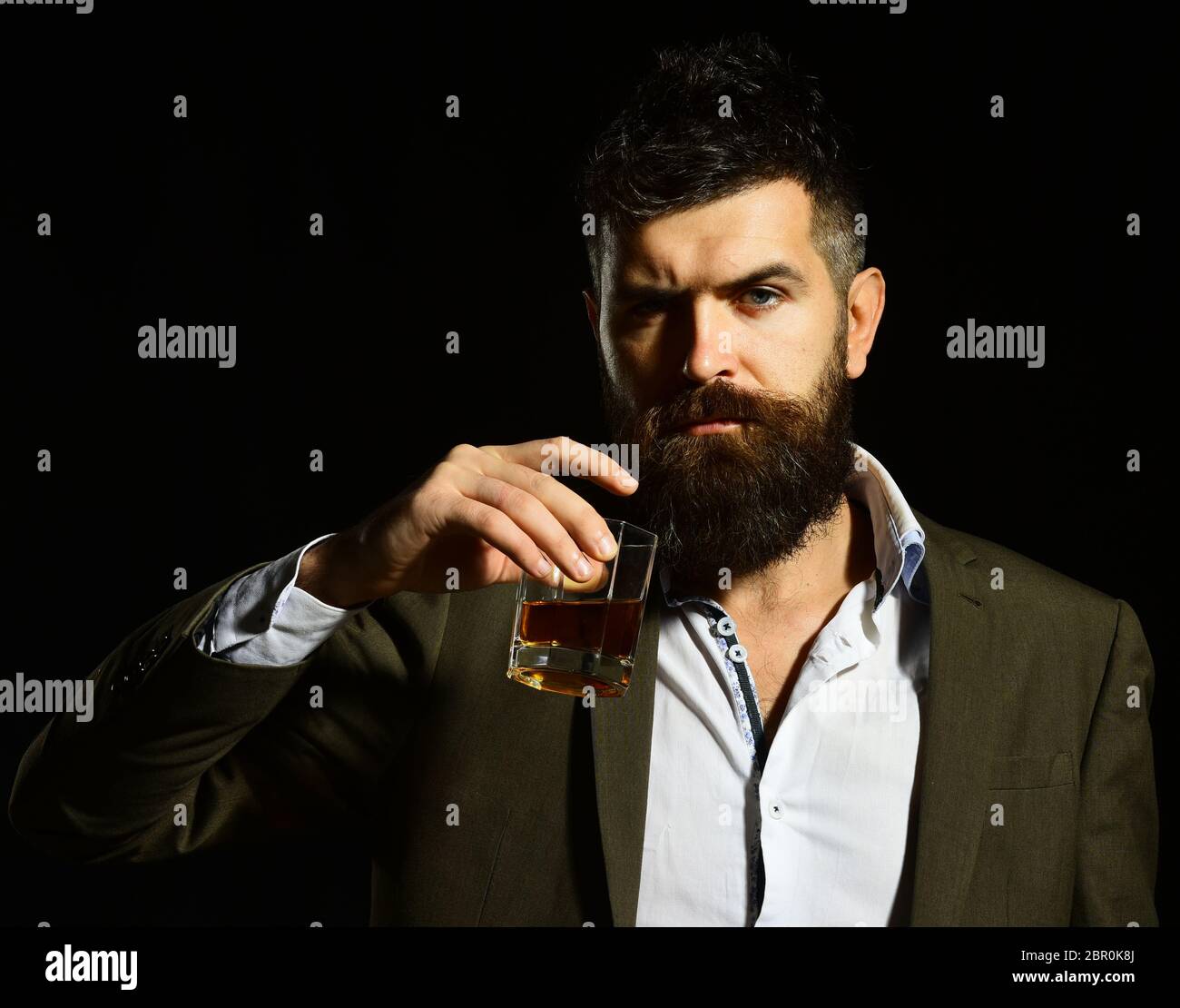 Drinking and party concept. Connoisseur with elegant look drinks cognac ...