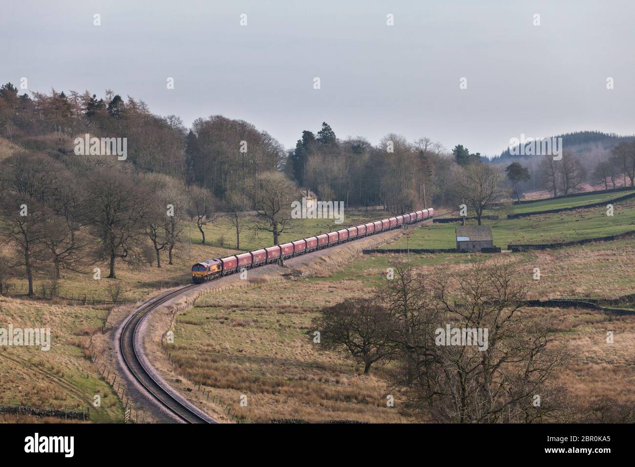 DB cargo class 66 locomotive 66174 hauling a train of aggregates on the ...