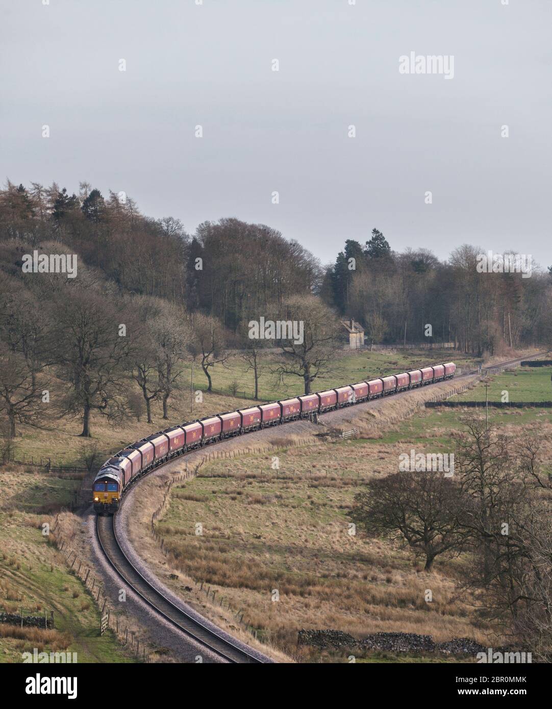 DB cargo class 66 locomotive 66174 hauling a train of aggregates on the ...