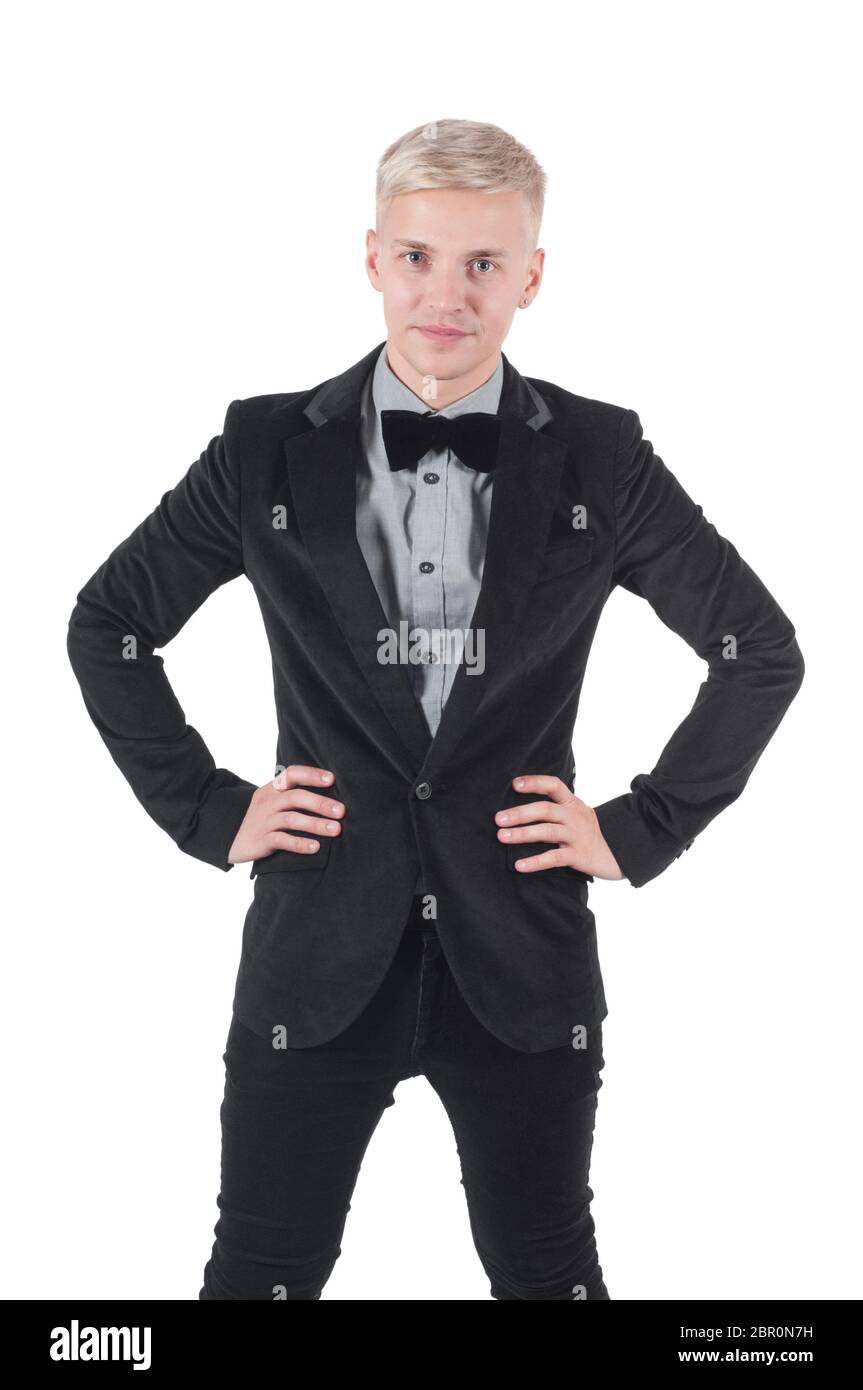 Man in jacket and bow-tie standing with crossed arms Stock Photo - Alamy
