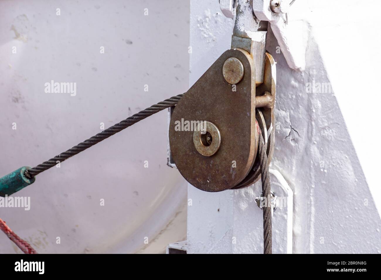 Pulley and rope on a boat. Small detail Stock Photo - Alamy