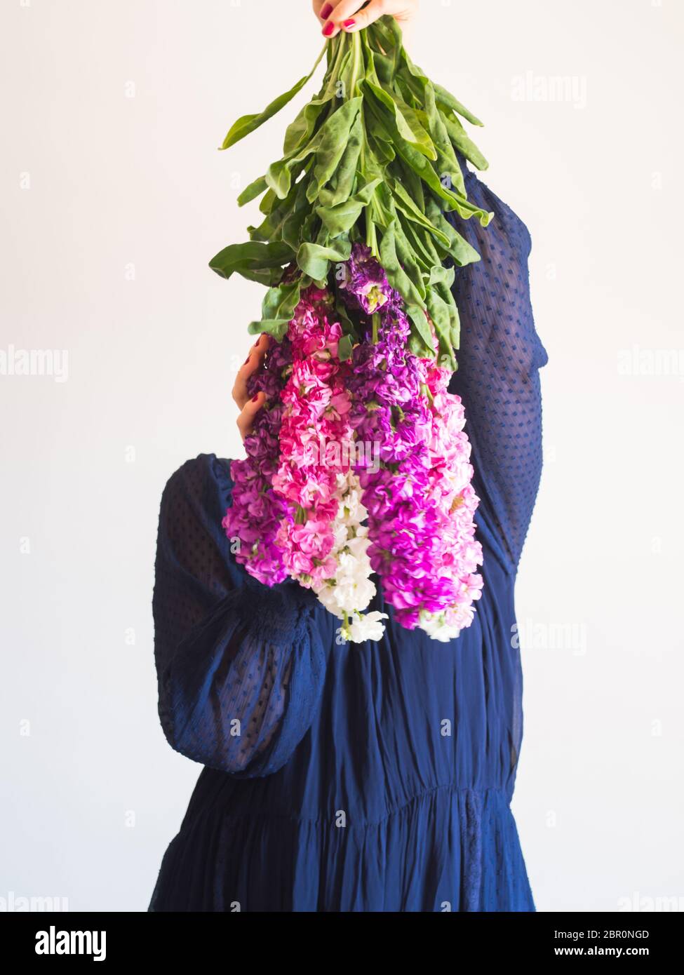 Creative female faceless portrait with bunch of flowers Stock Photo - Alamy