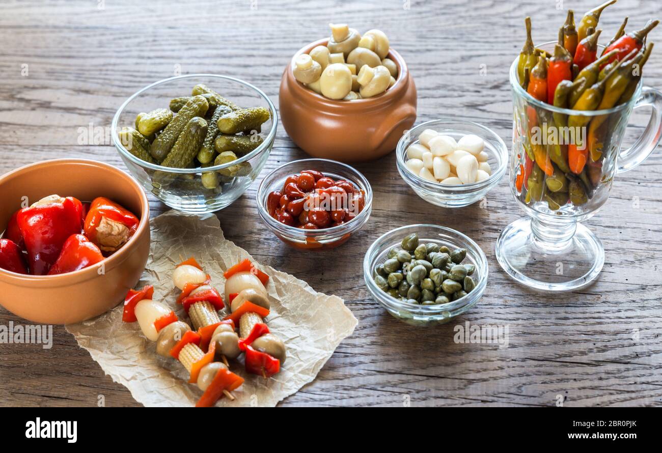 Pickled vegetables on the wooden background Stock Photo - Alamy