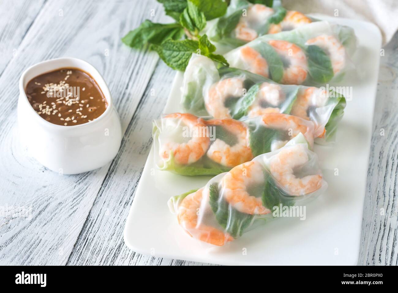 Shrimp rice paper rolls with peanut sauce Stock Photo - Alamy