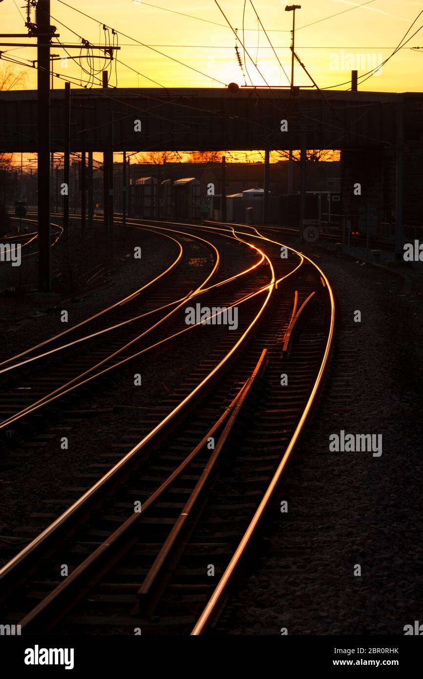 sunset on the railway line with the crossover points at the west end of ...
