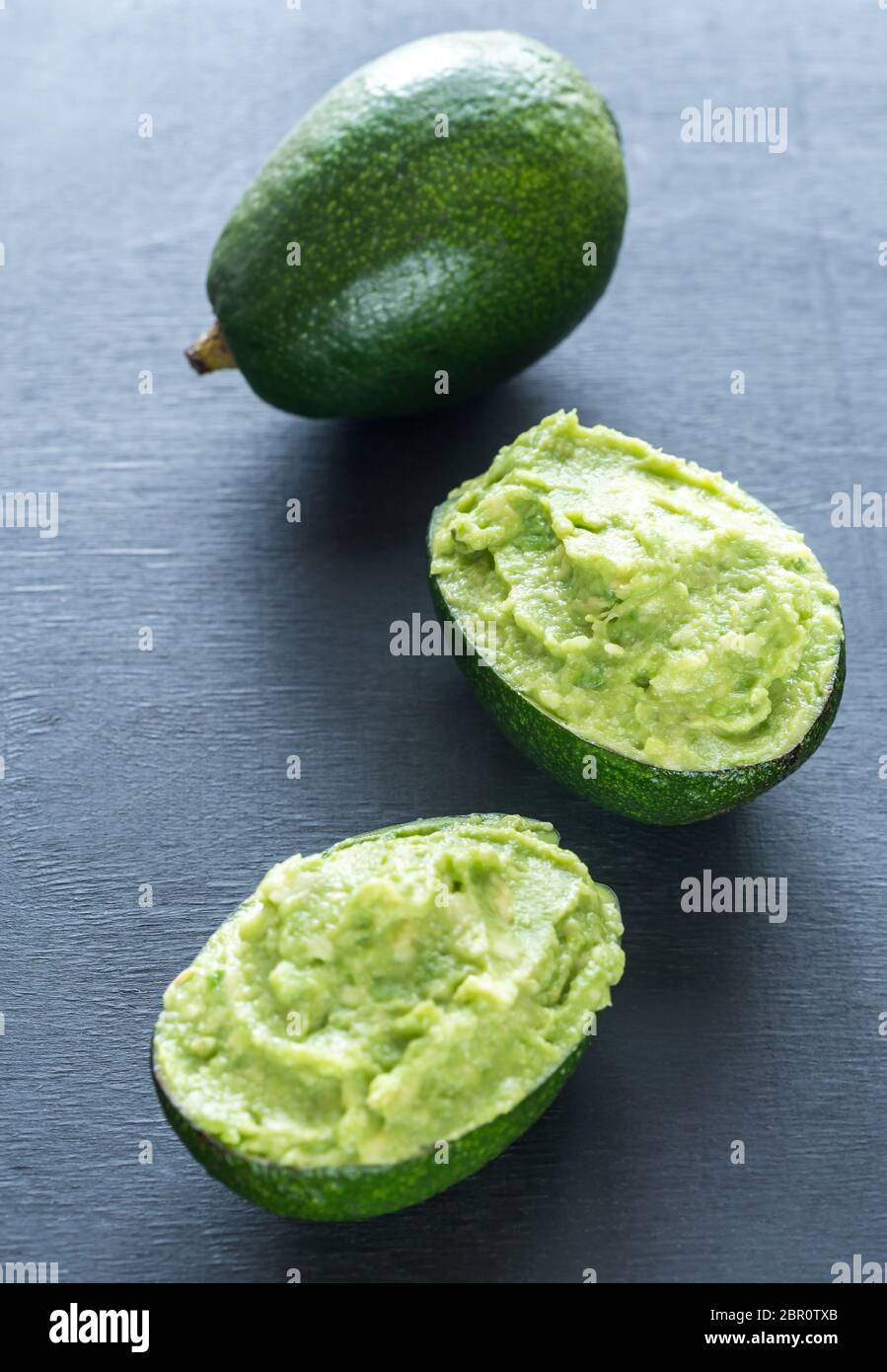 Guacamole in avocado shells Stock Photo - Alamy