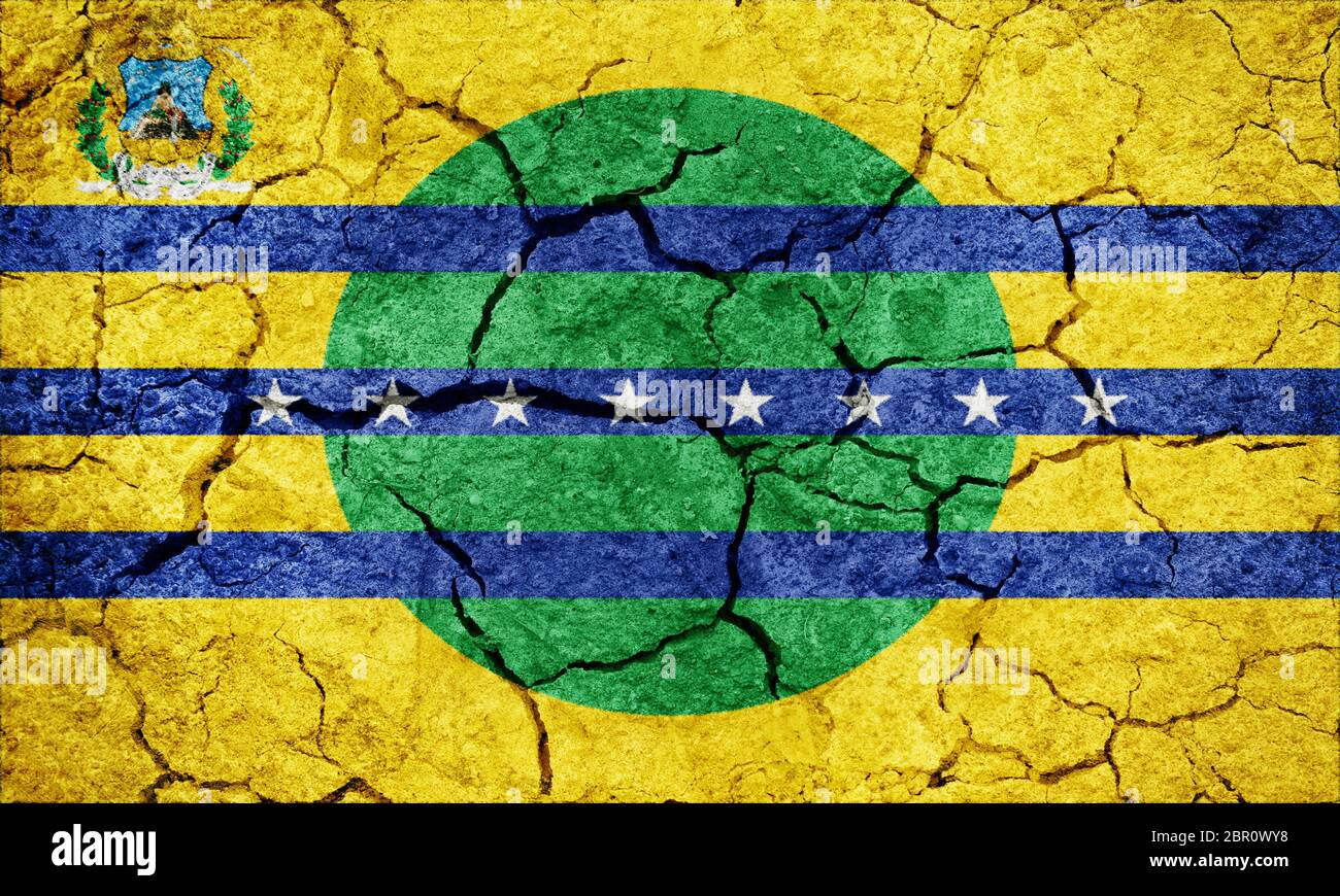 Bolivar State flag, state of Venezuela, on dry earth ground texture ...