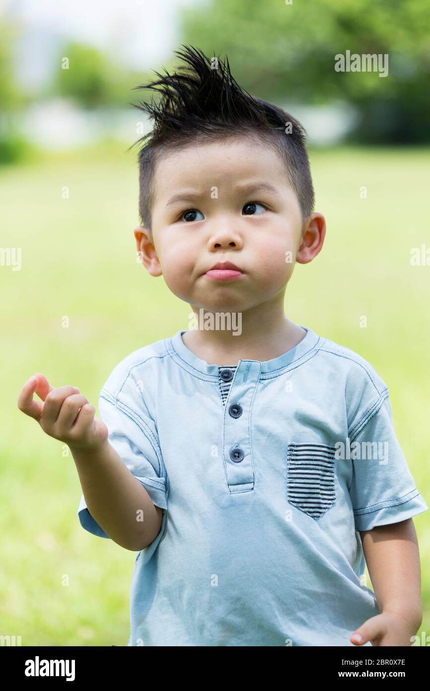 Little boy eating snack Stock Photo - Alamy