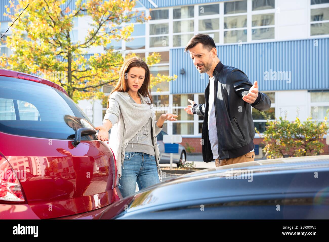 Young Man And Woman Arguing With Each Other After Car Accident On ...