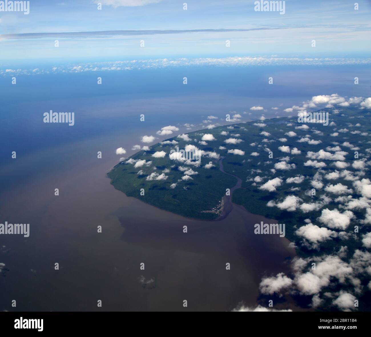 Aerial view of an island that appears to be floating above the ocean ...