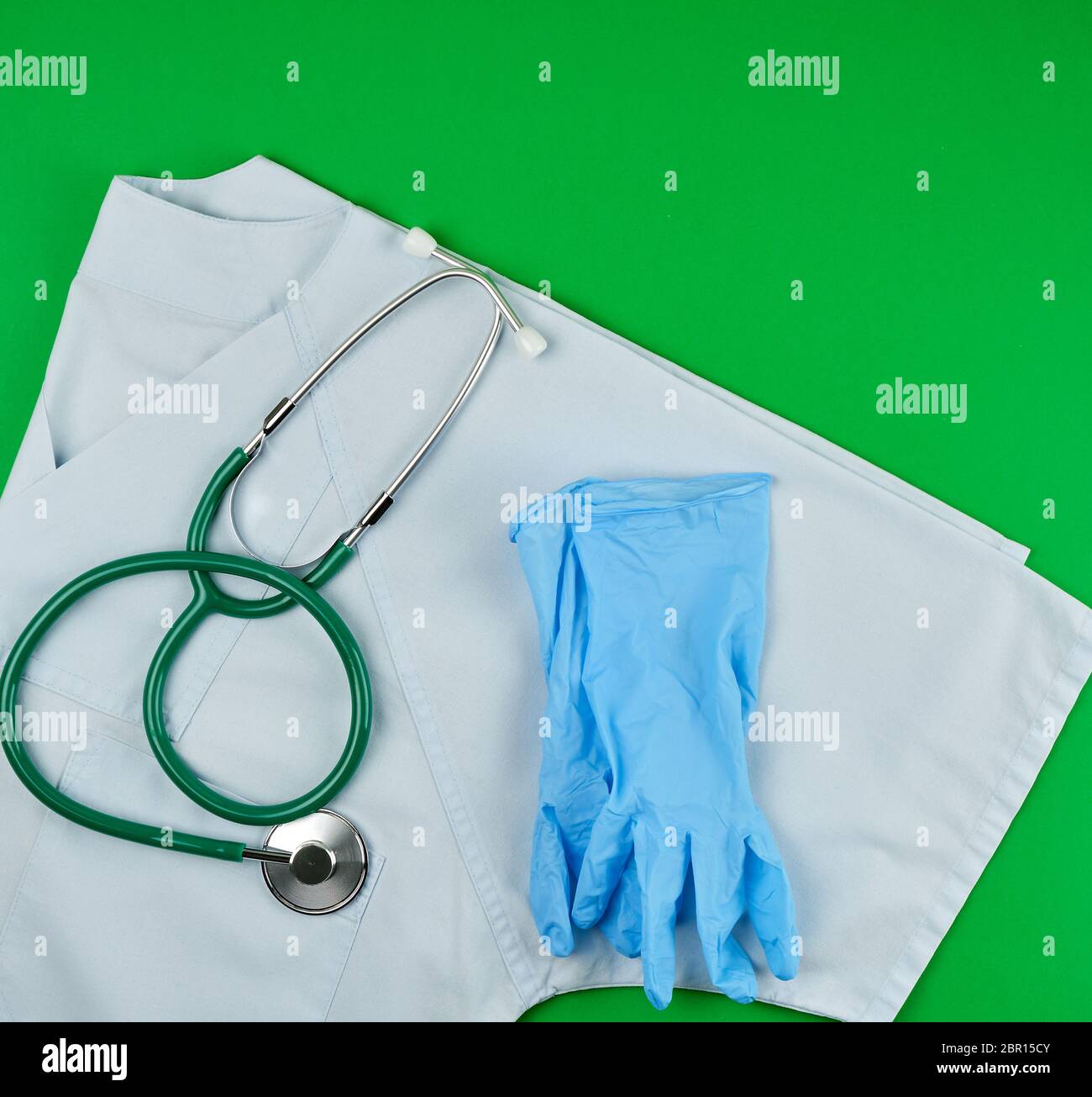 blue medic uniform and green stethoscope with blue latex gloves, top ...