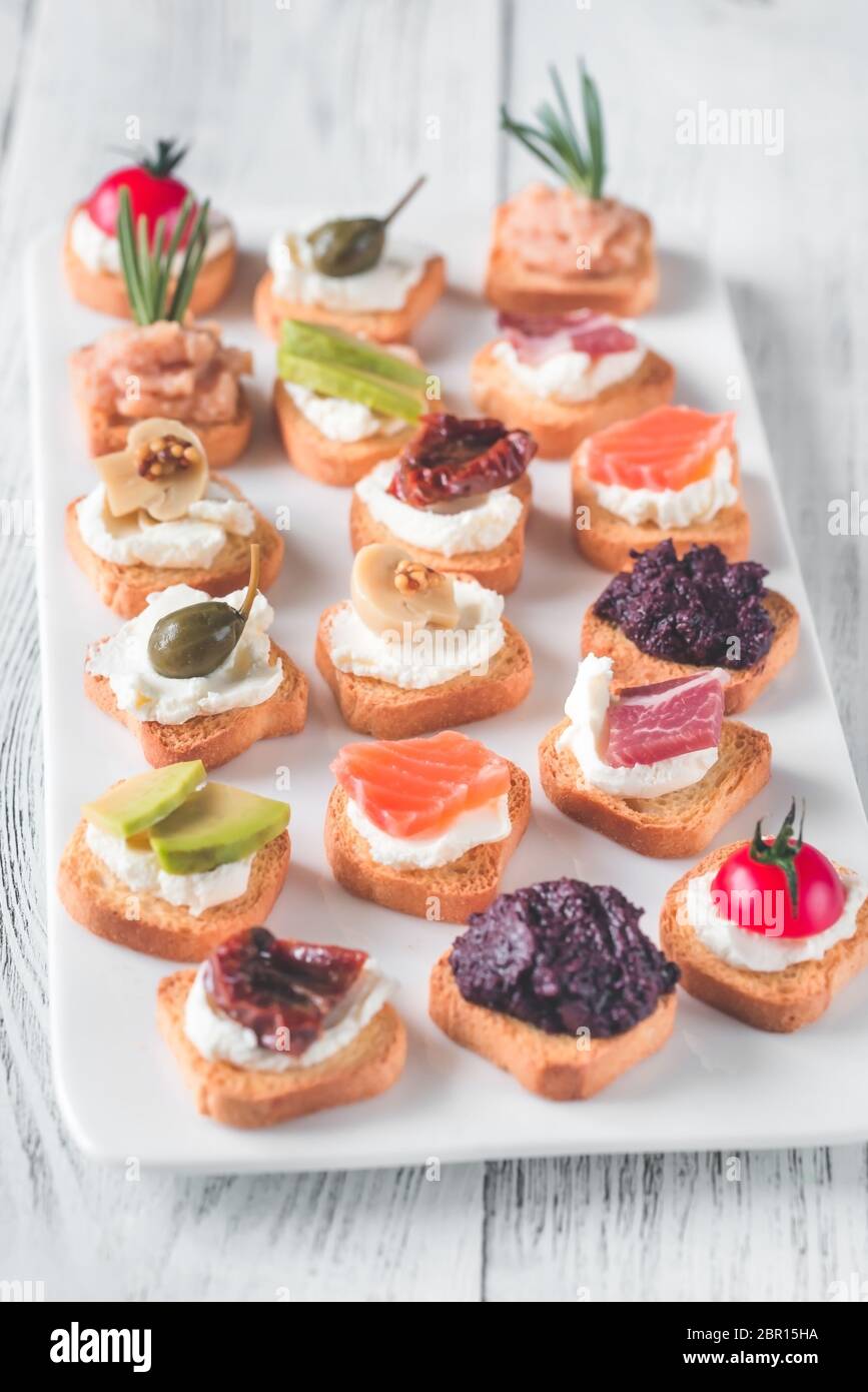 Crostini with different toppings Stock Photo - Alamy