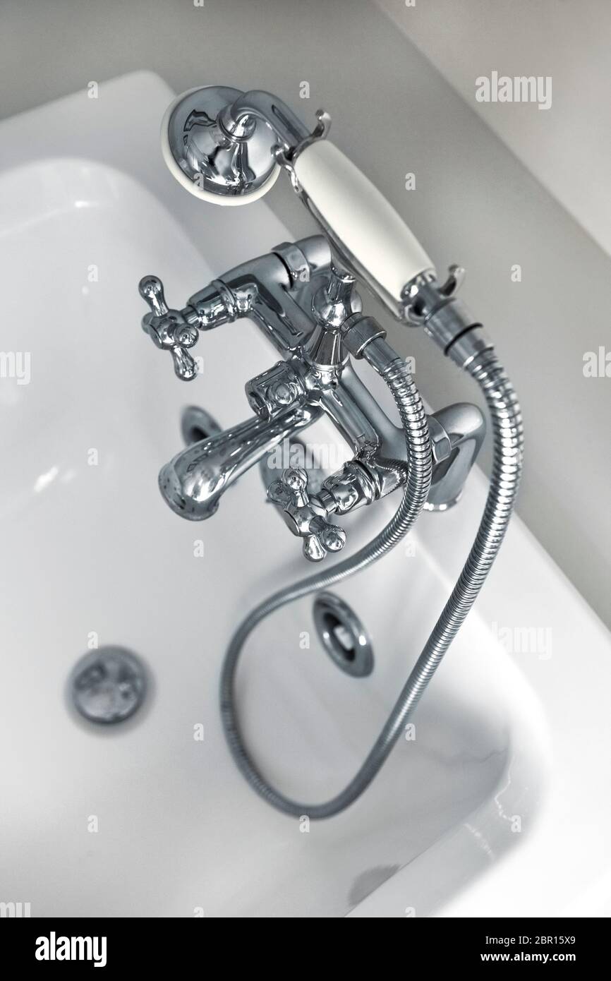 Vintage chrome shower and bath inside a bathroom Stock Photo - Alamy