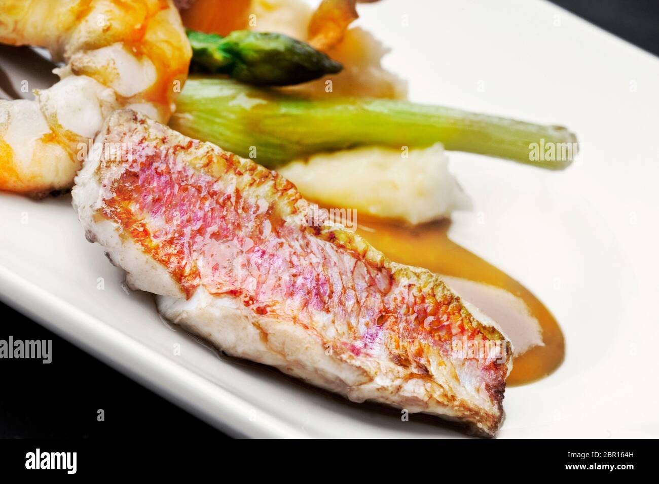 Dish of red mullet and various vegetables Stock Photo - Alamy