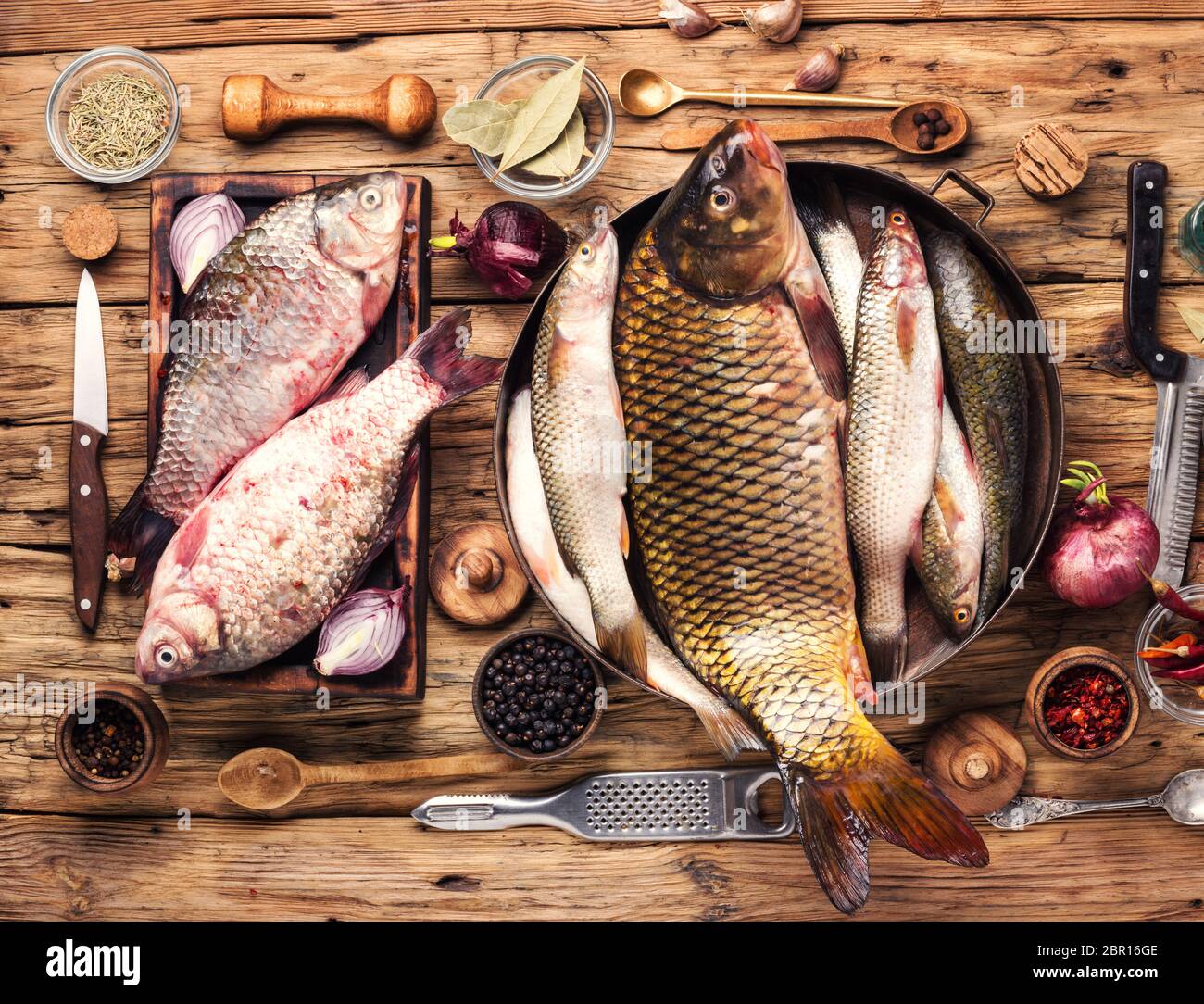 Fresh raw fish on wooden cutting board.Raw fish with spices for cooking ...