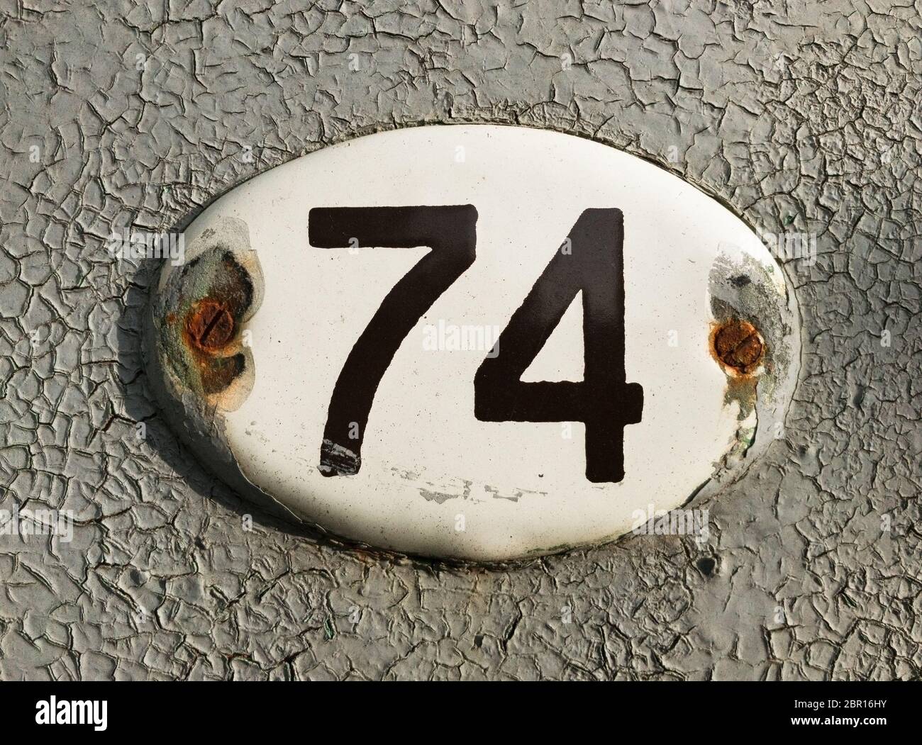 old house number plate No 74 Stock Photo - Alamy