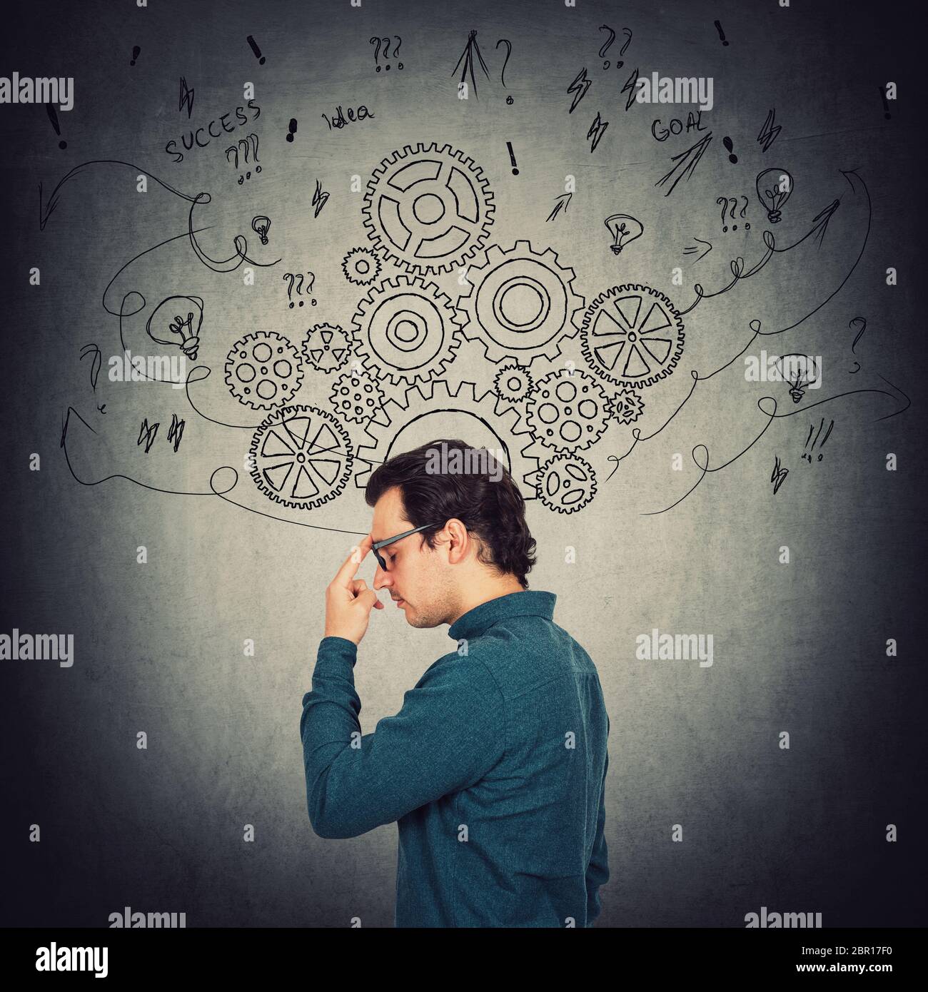 Side view portrait of pensive businessman, keeps index finger to ...