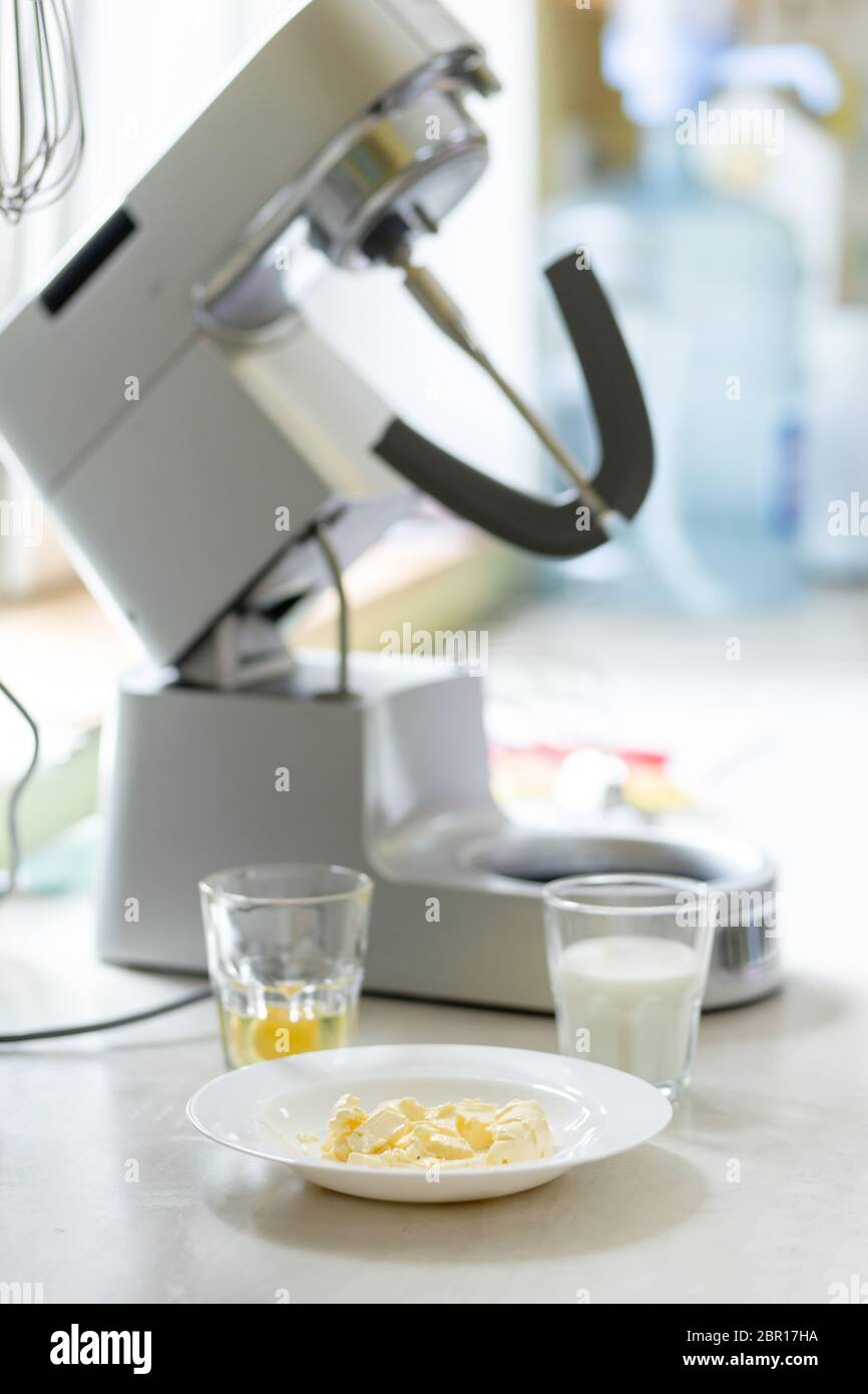 professional pastry chef preparing a dessert. Adds ingredients and ...