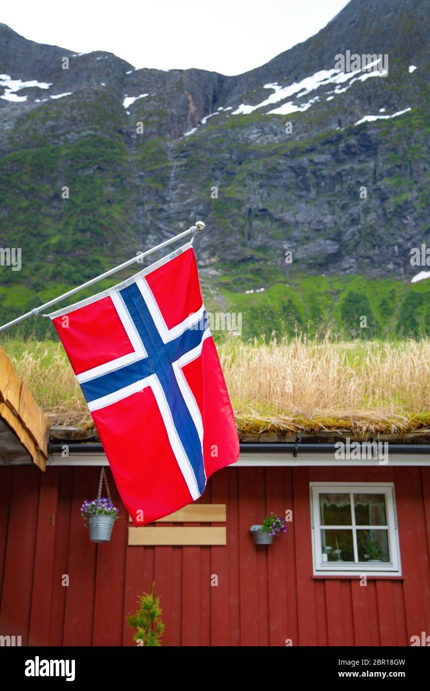 Flag of Norway against the background of the national Norwegian house ...