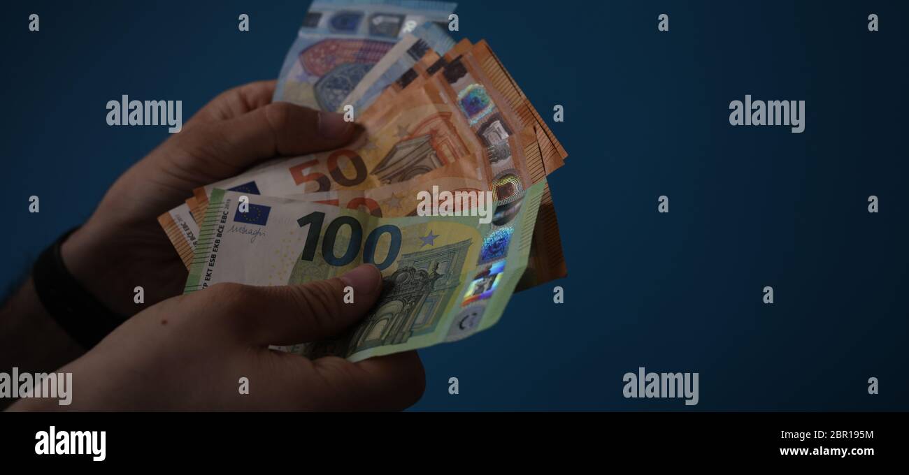 money in hand euro banknote Stock Photo - Alamy