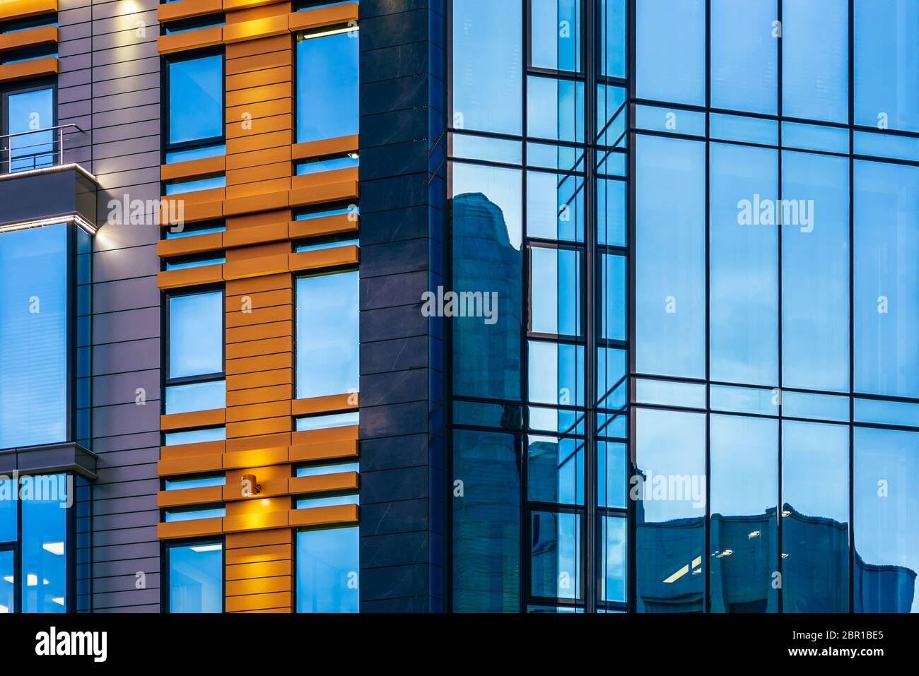 Modern high-rise office building with a glass facade, background Stock ...