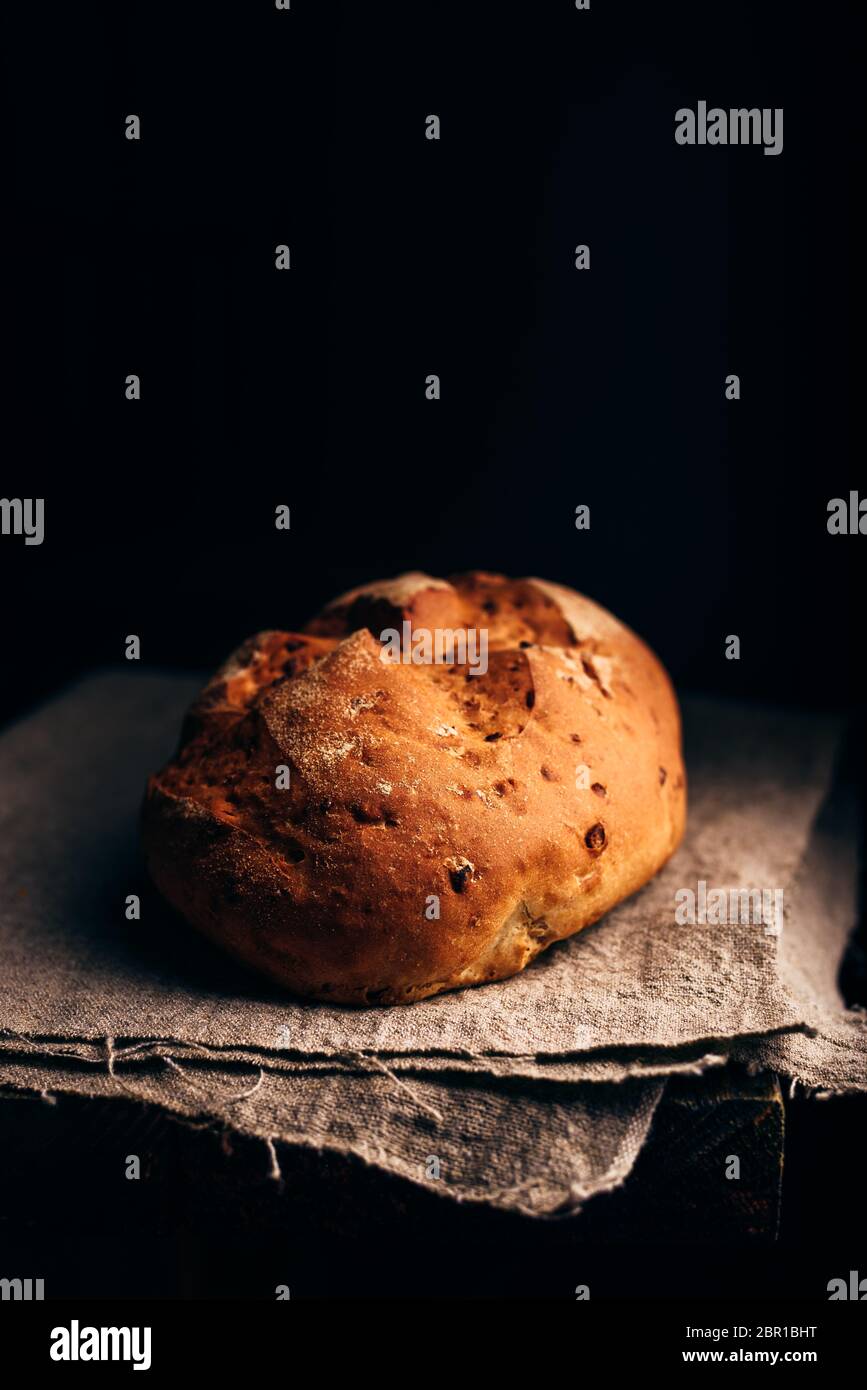 Loaf of Bread on Grey Cloth. Dark Background and Copy Space on the Top ...